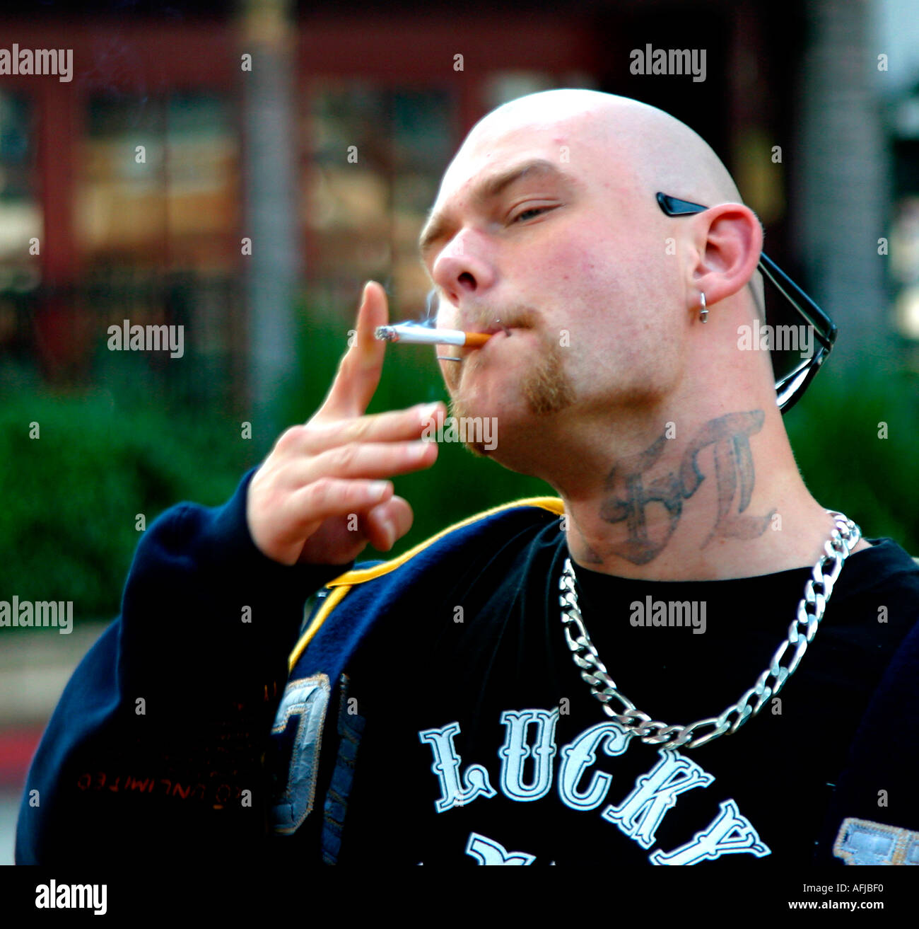 BALD PUNK MAN SMOKING CIGARETTE Stock Photo - Alamy