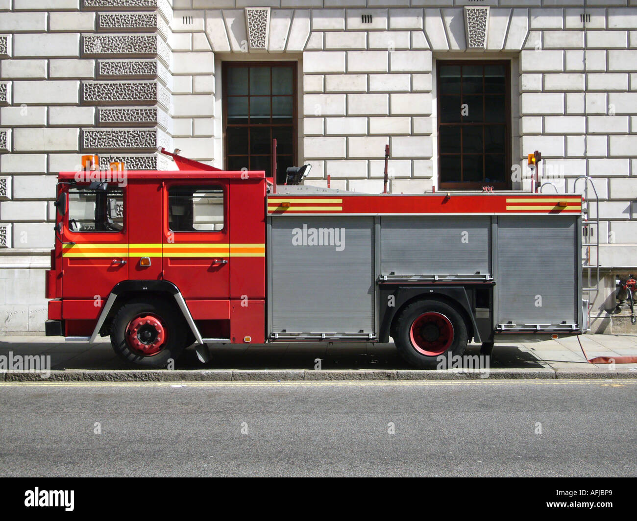 Red fire engine truck in London UK Stock Photo - Alamy