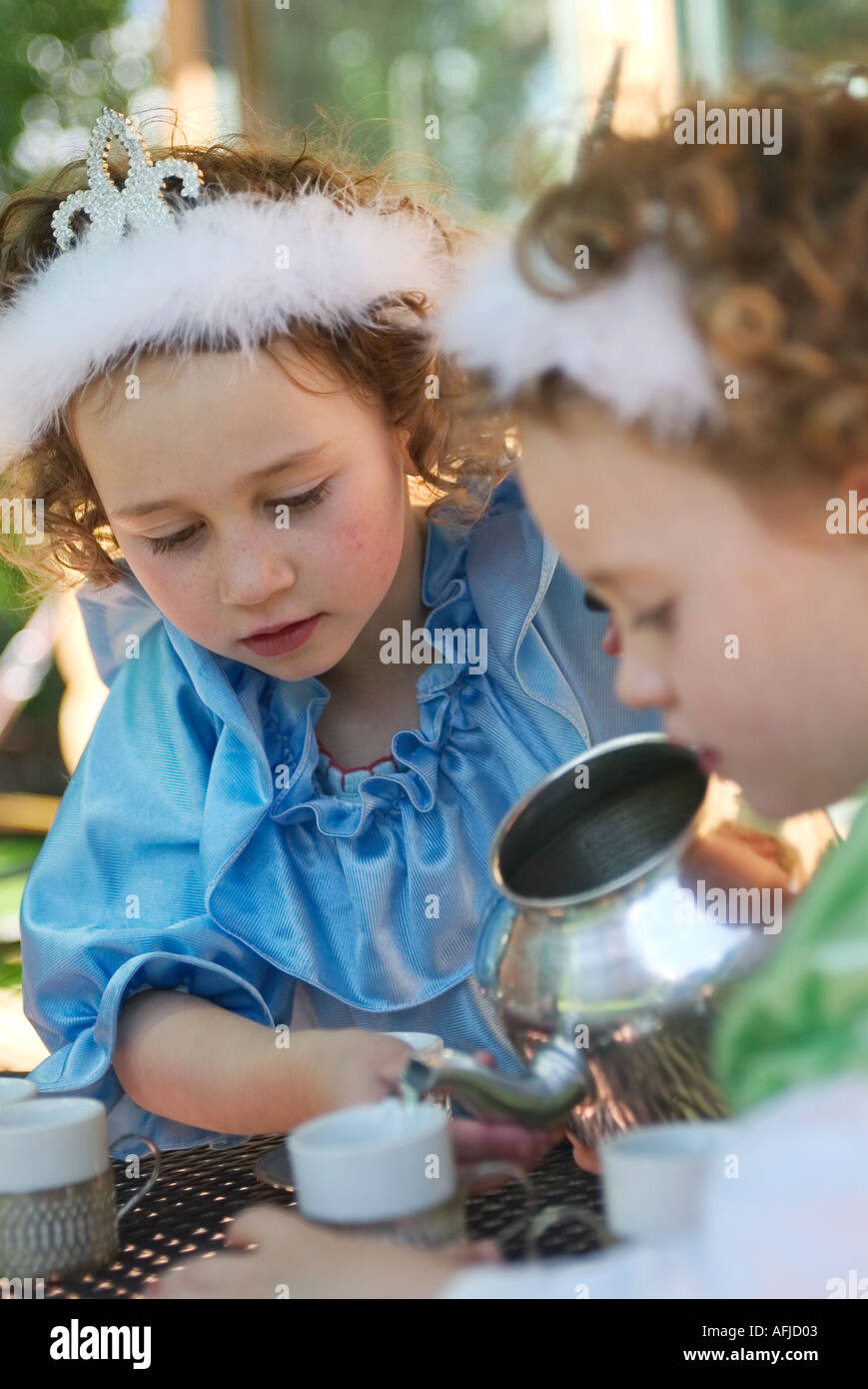 two girls teaparty Stock Photo - Alamy