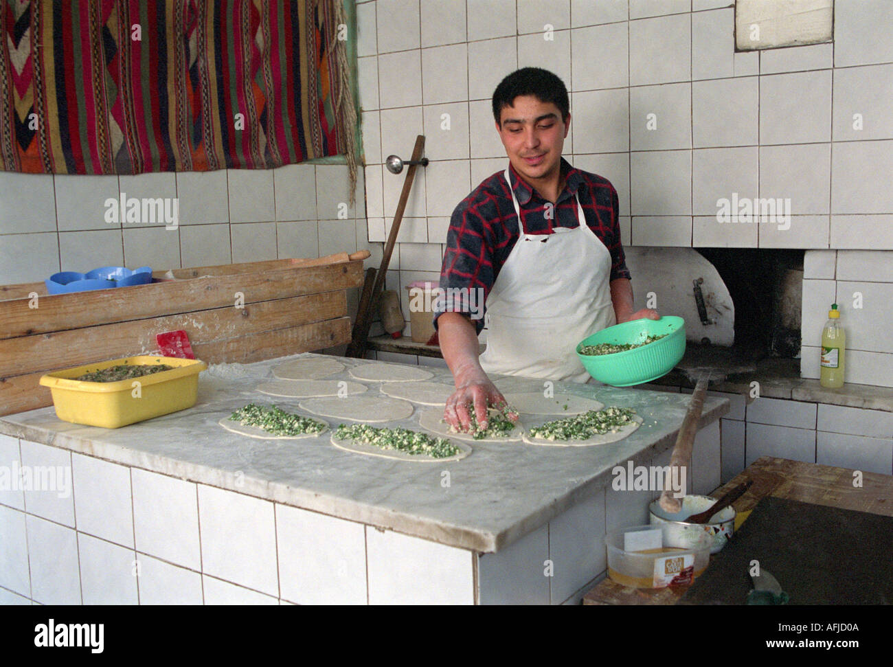 Baker bread young ethnic hi-res stock photography and images - Alamy