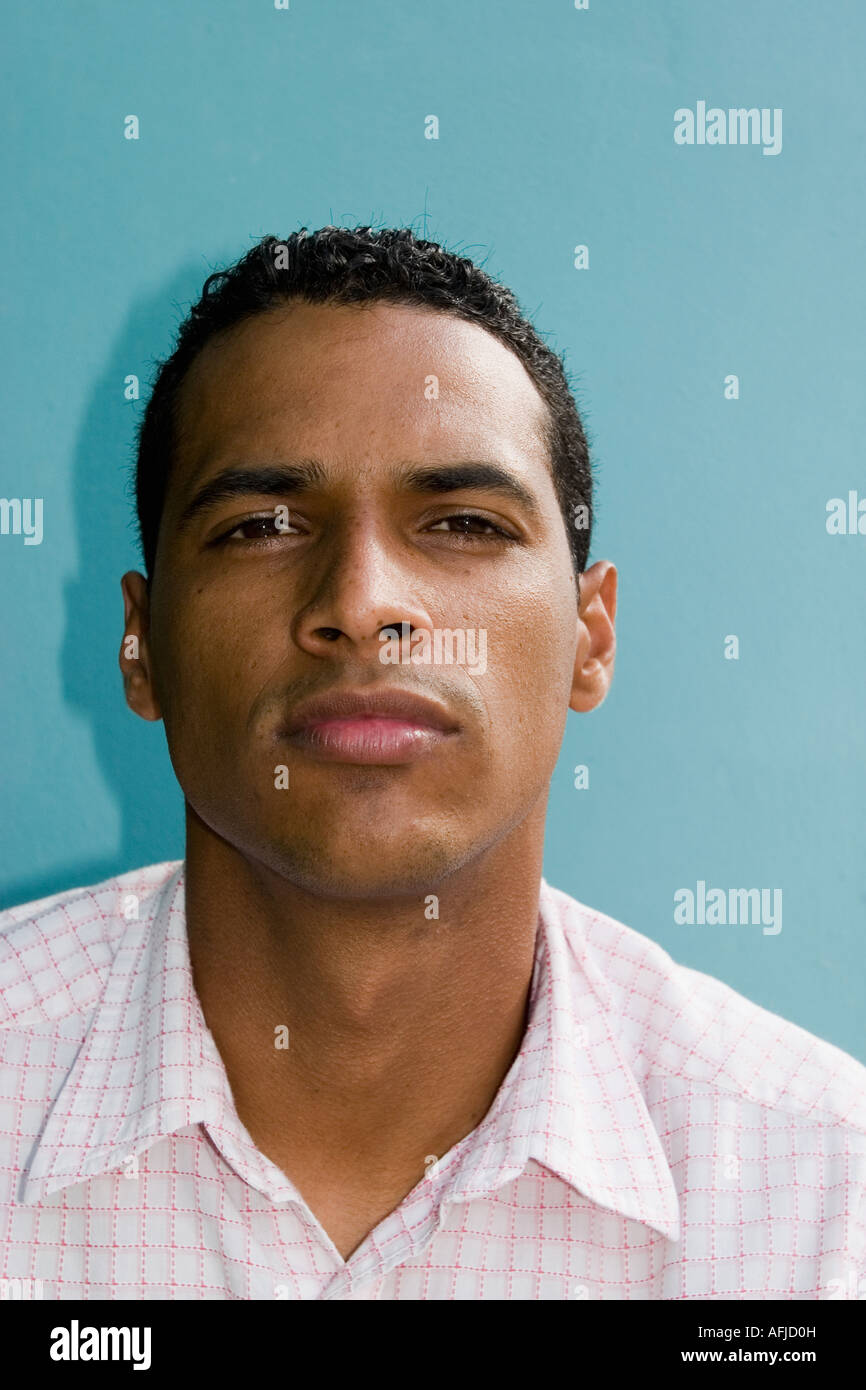 Young man looking serious Stock Photo - Alamy