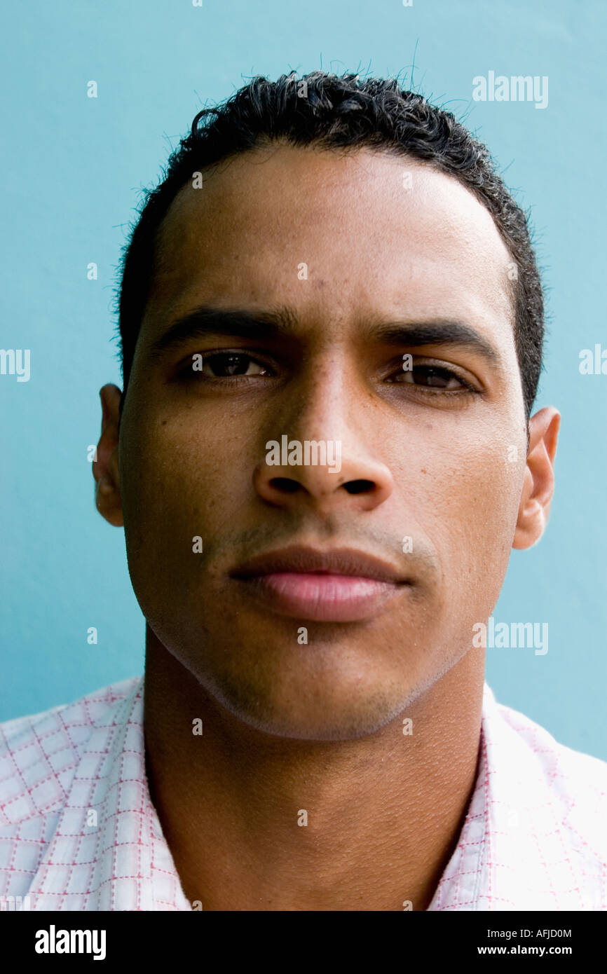 Young man looking serious Stock Photo - Alamy