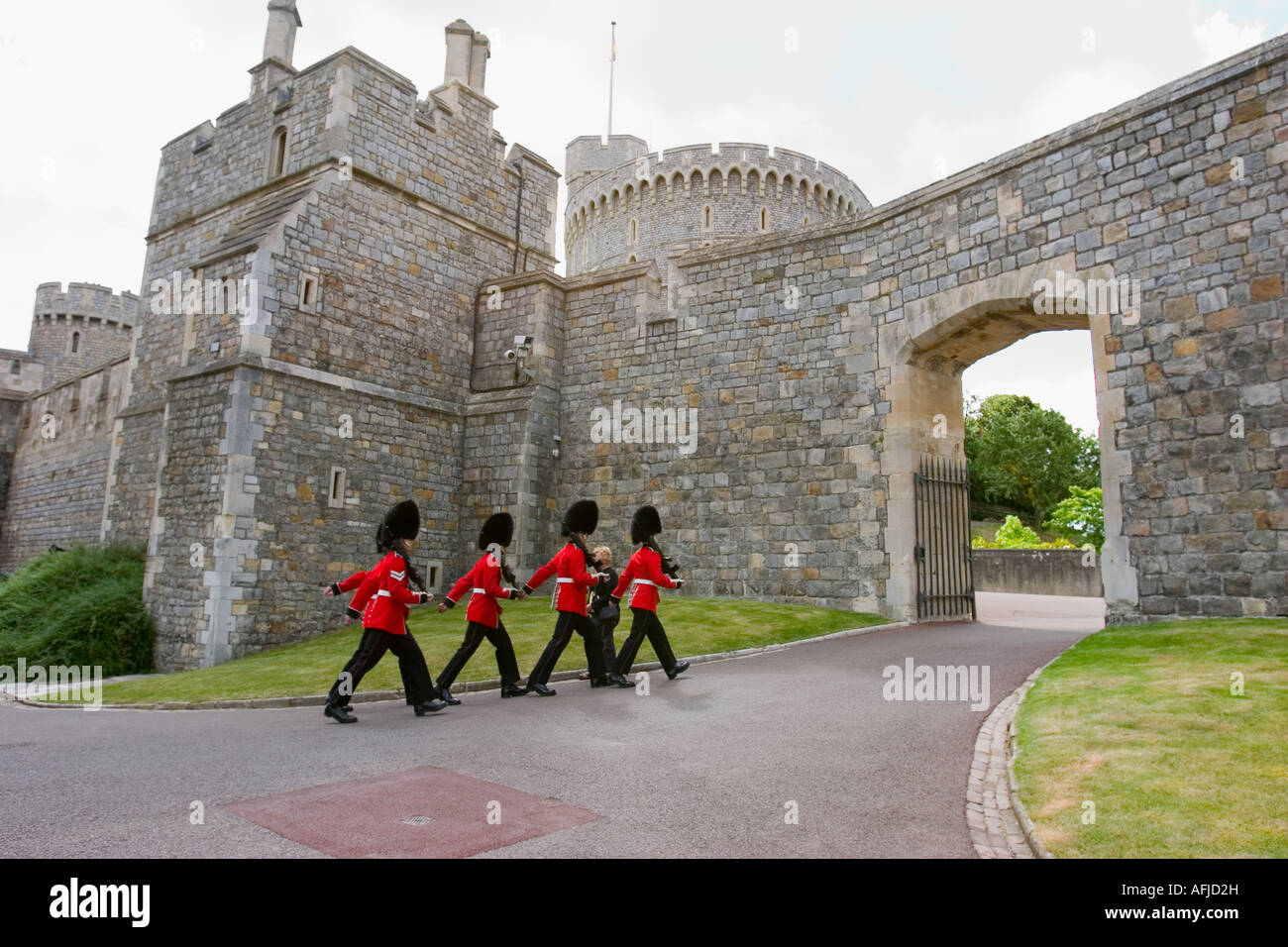 Side profile of soldiers walking in front of a fort Stock Photo - Alamy