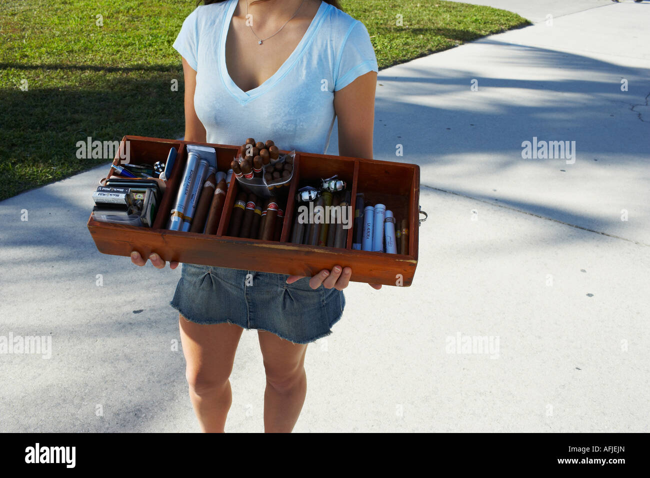 Woman selling cigars at beach Stock Photo - Alamy