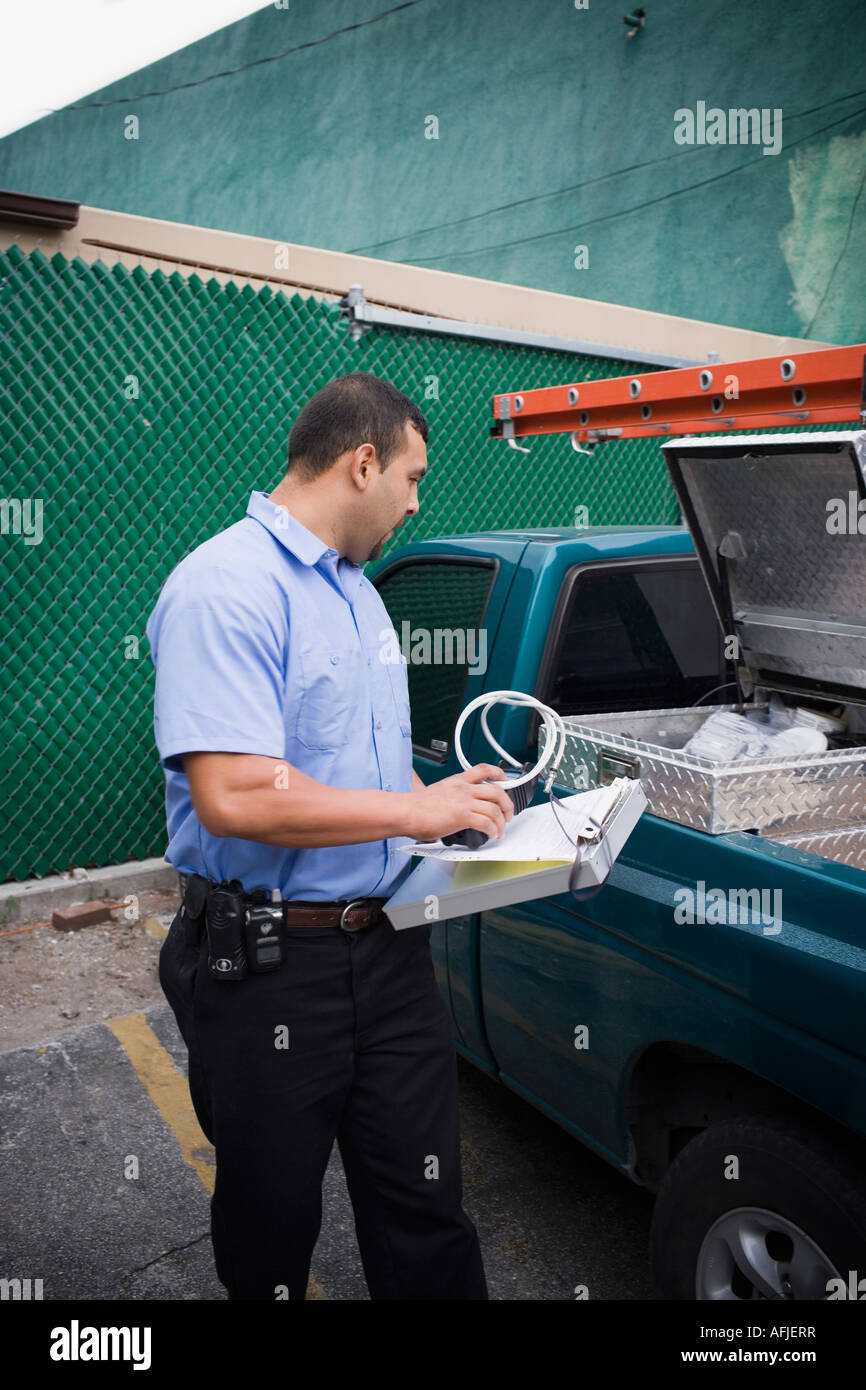 Cable man standing near his truck Stock Photo - Alamy