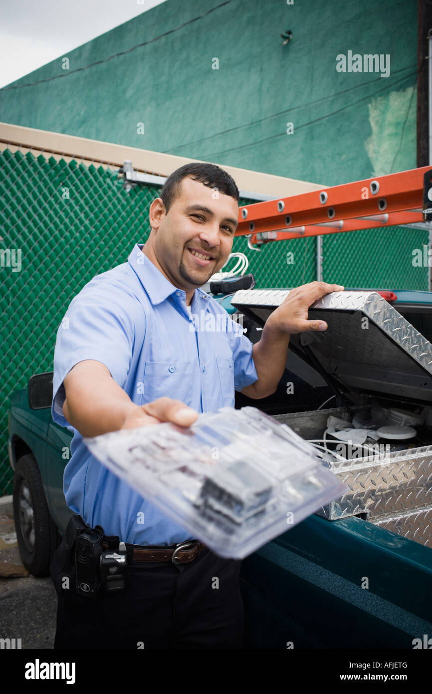 Cable man standing near his truck Stock Photo - Alamy