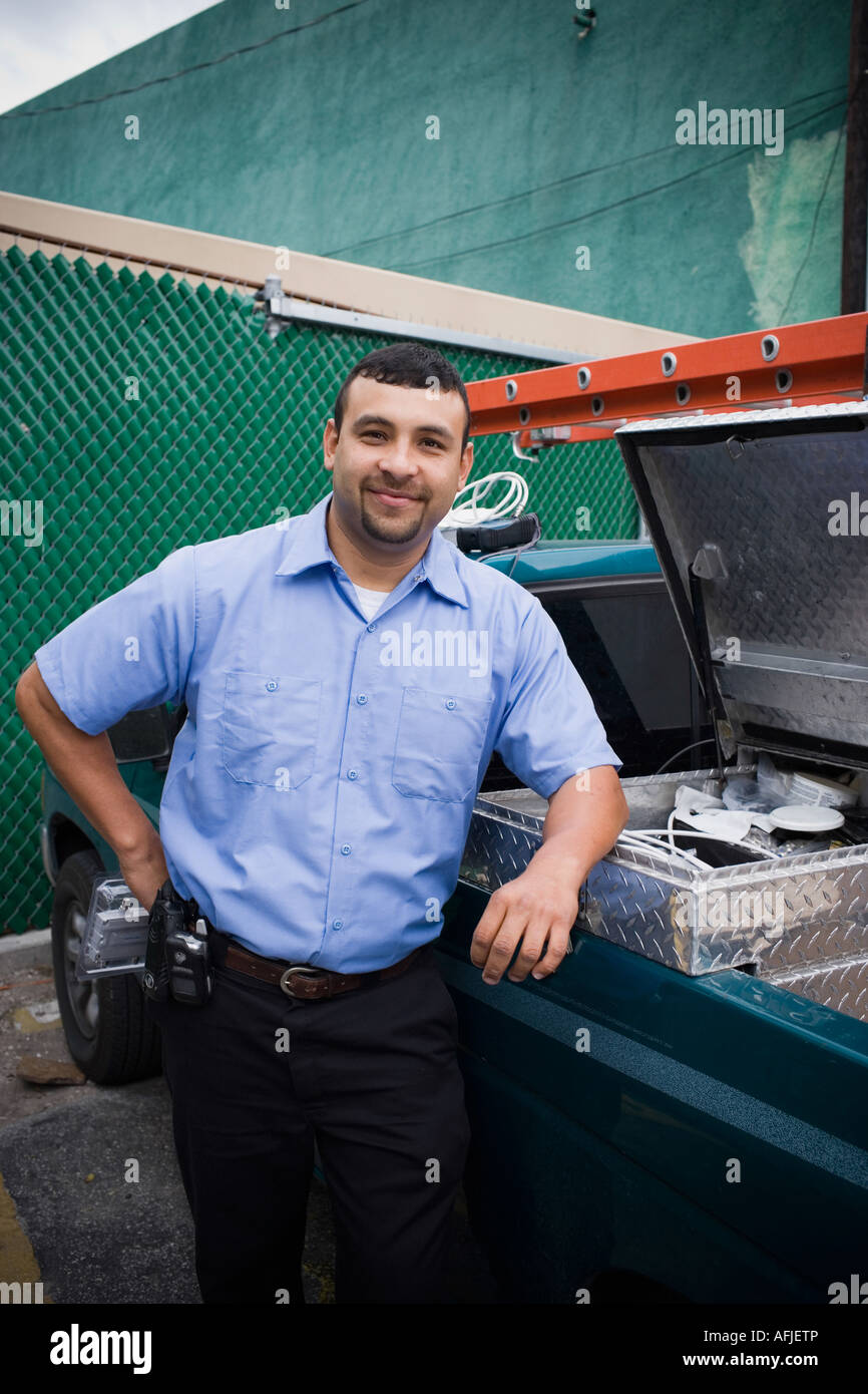 Cable man standing near his truck Stock Photo - Alamy