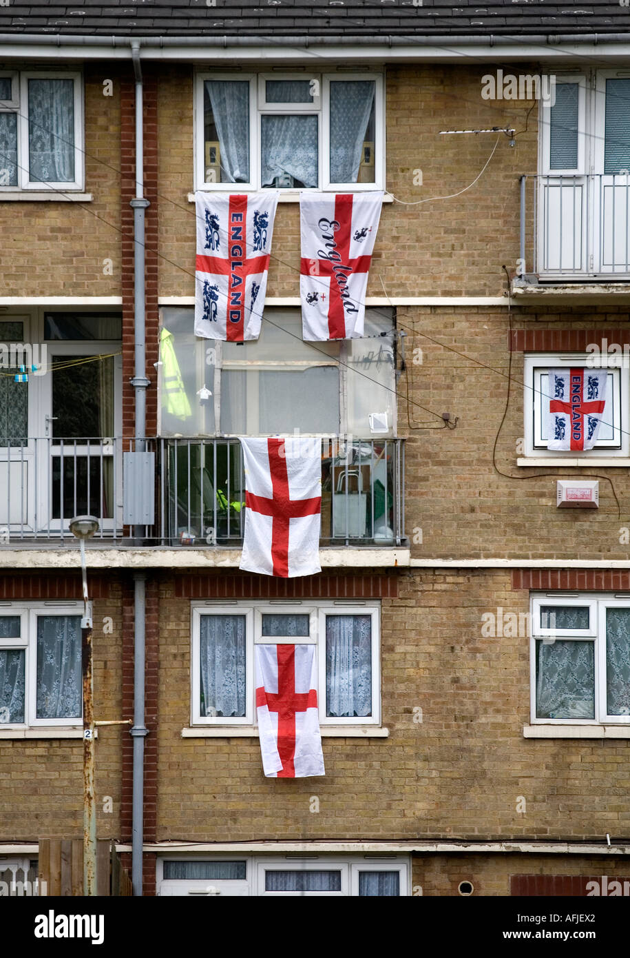The flags of St George patront saint of England flying on a block of ...