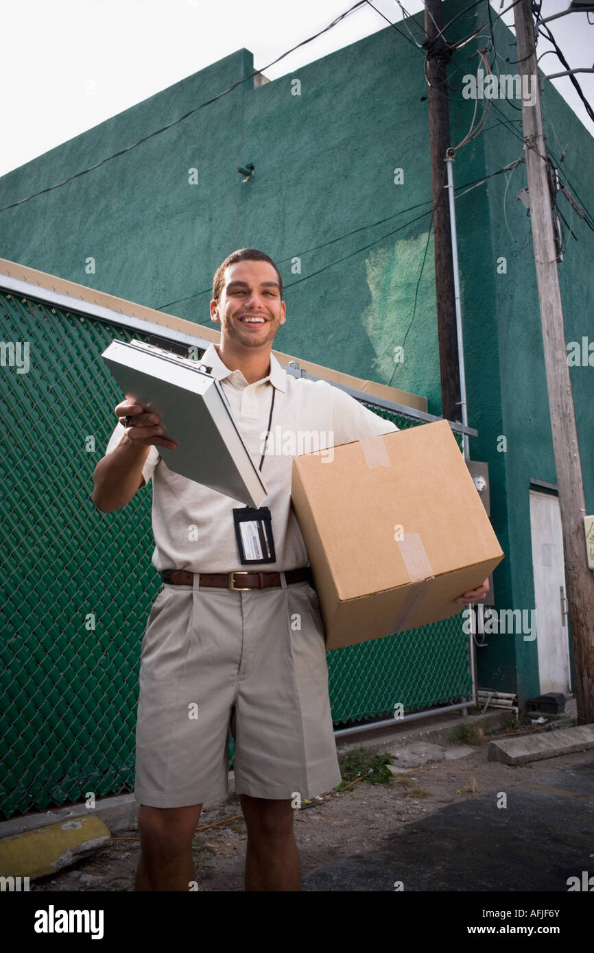 Delivery man making deliveries Stock Photo - Alamy