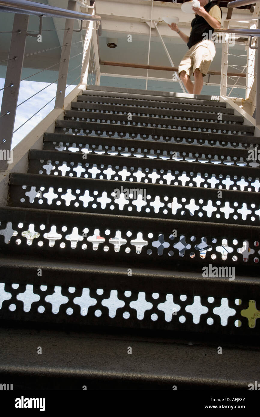 Person carrying plate of food on top of staircase Stock Photo - Alamy