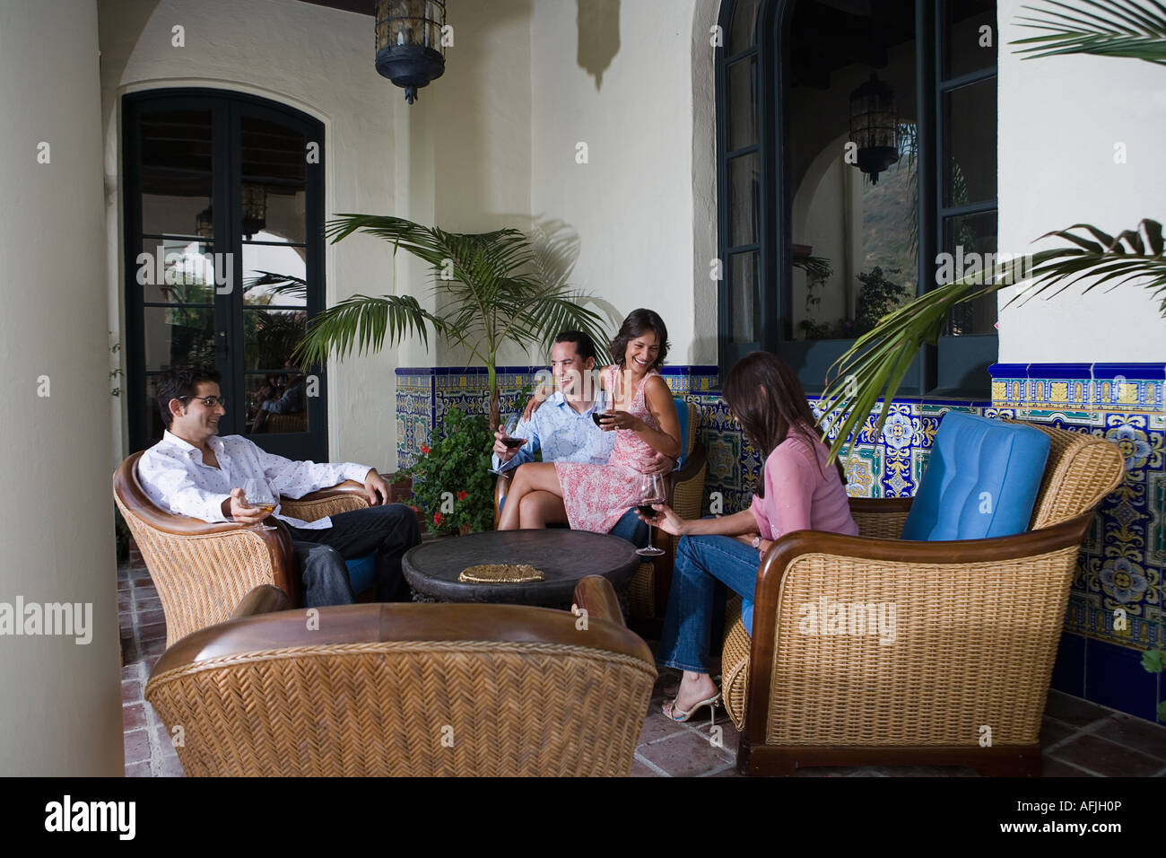 Group of friends socializing outdoors Stock Photo - Alamy