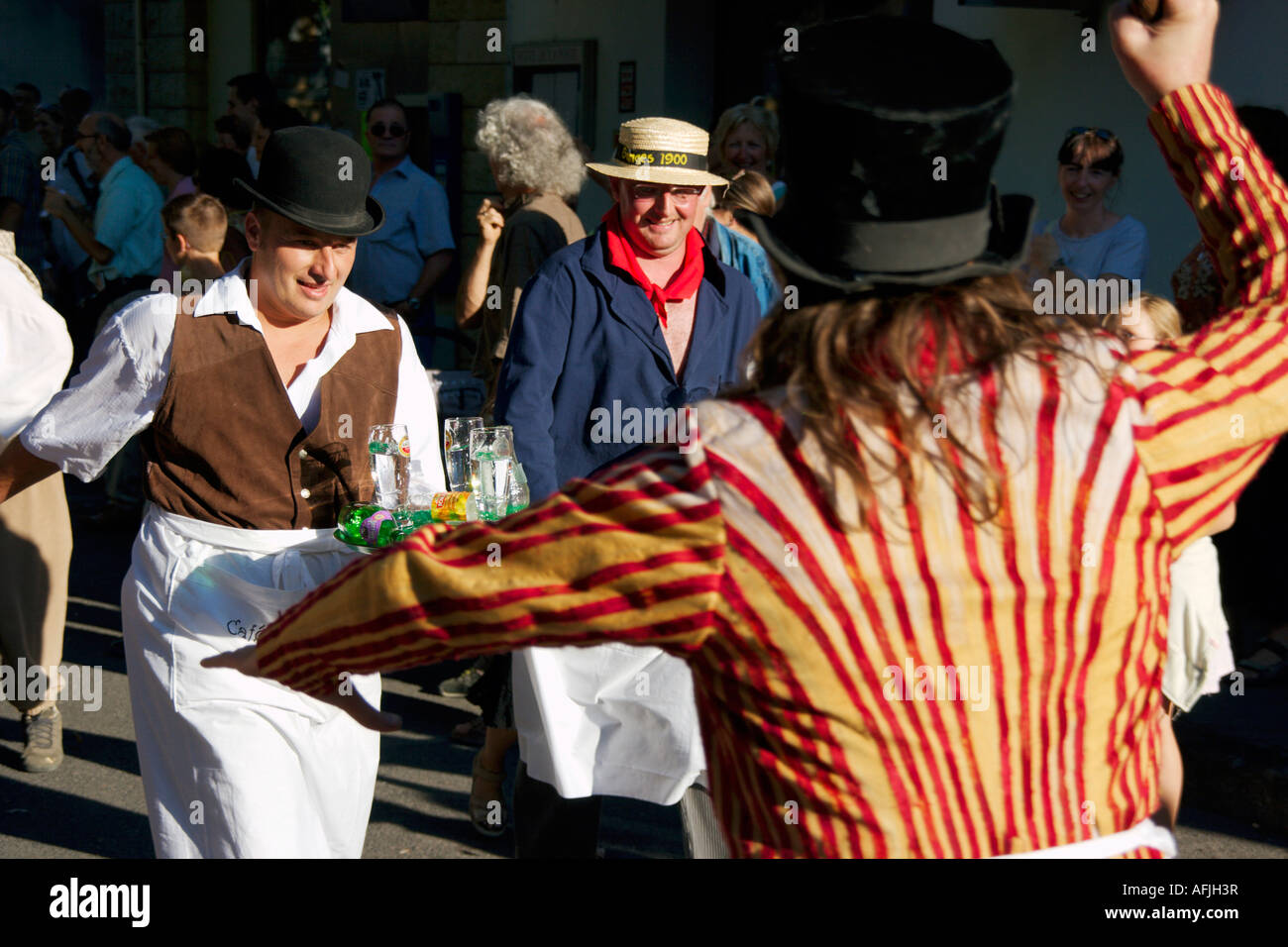 Waiters race at a 1900 reconstruction day in France Stock Photo - Alamy