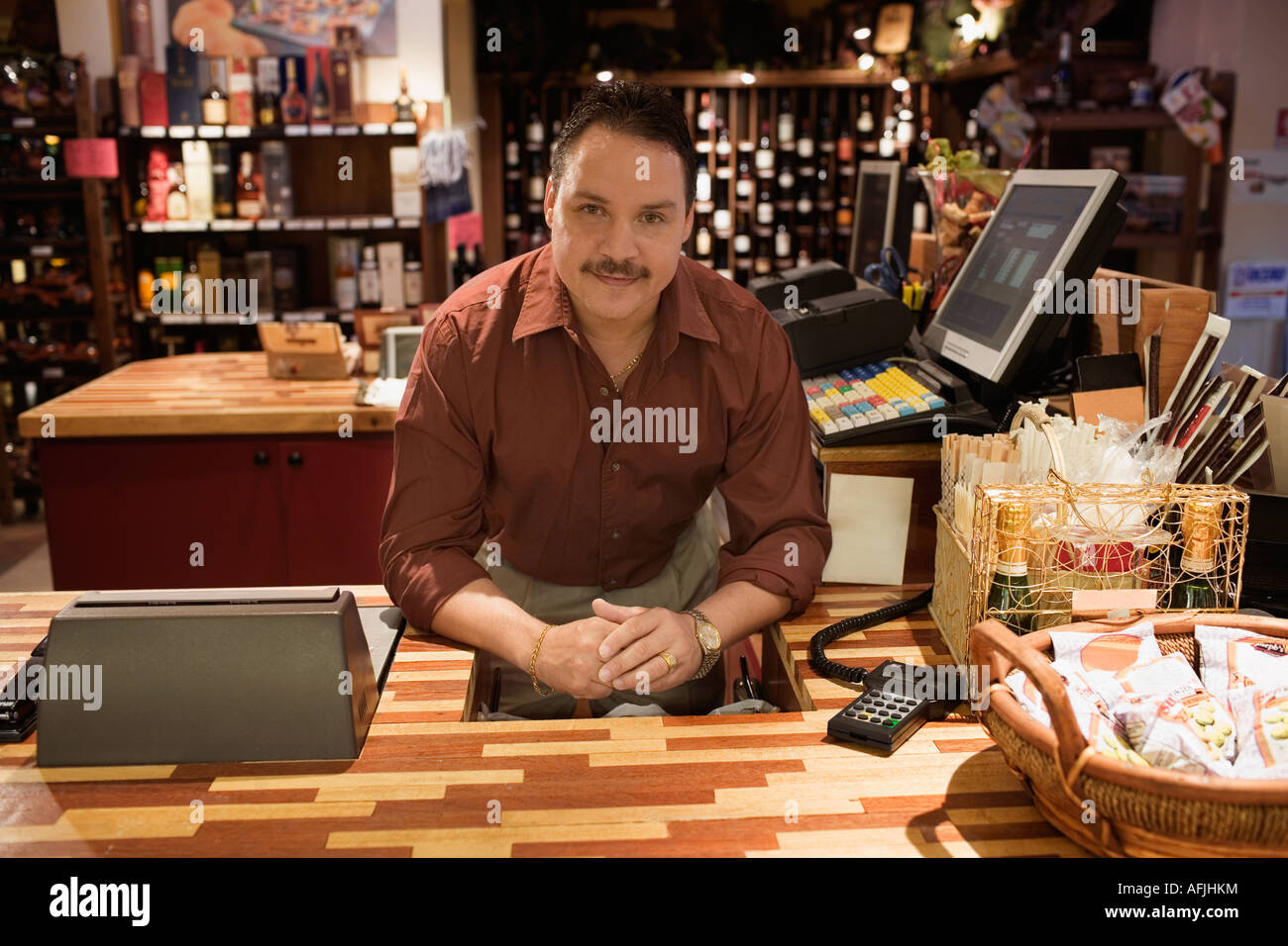 Small business owner in gourmet market Stock Photo - Alamy