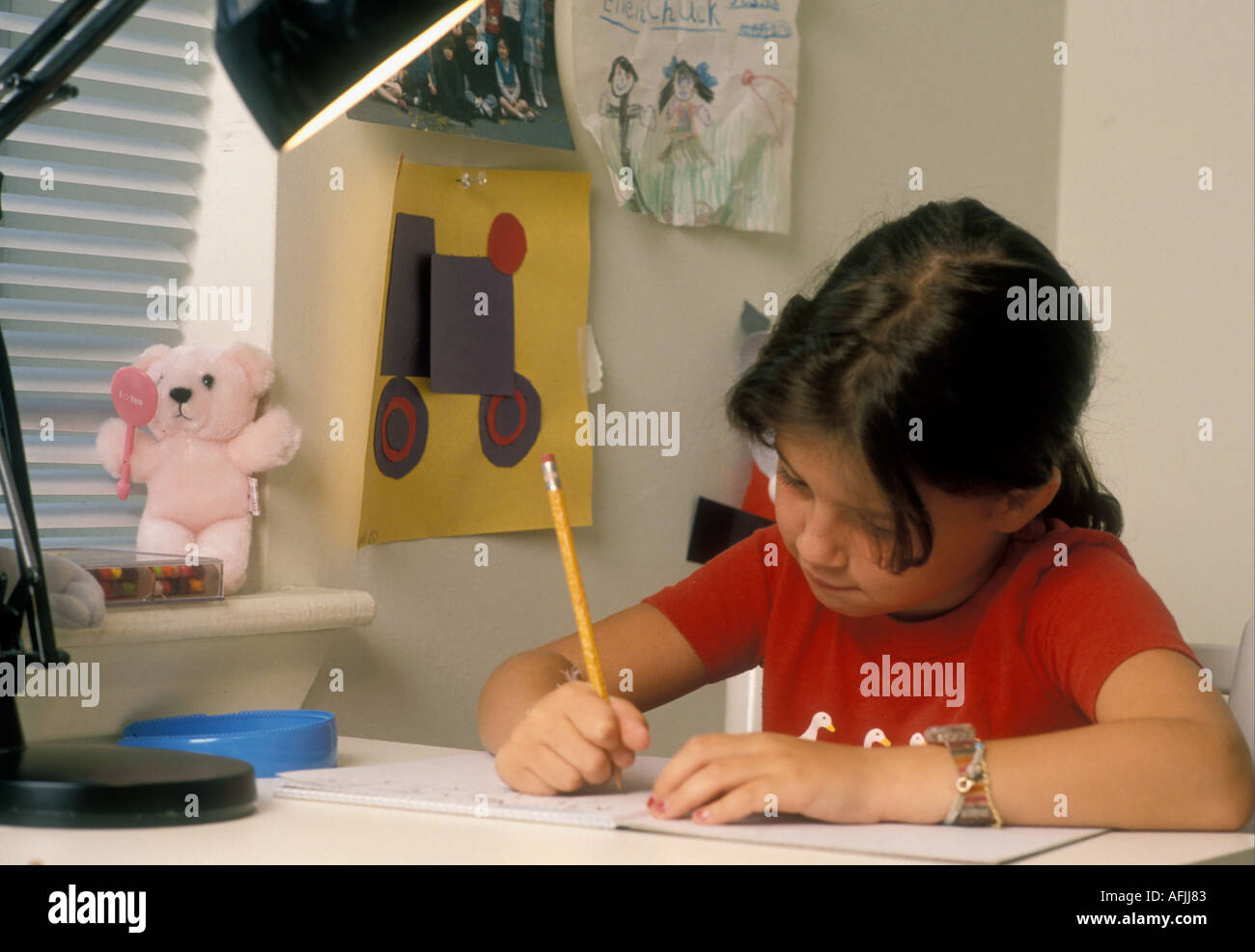 Child writing in bedroom hi-res stock photography and images - Alamy