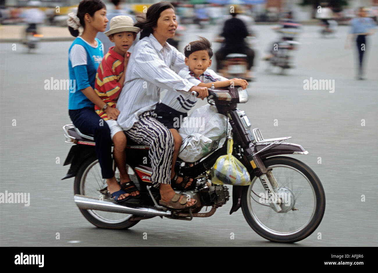Family on motorcycle, Ho Chi Minh City, Vietnam Stock Photo - Alamy