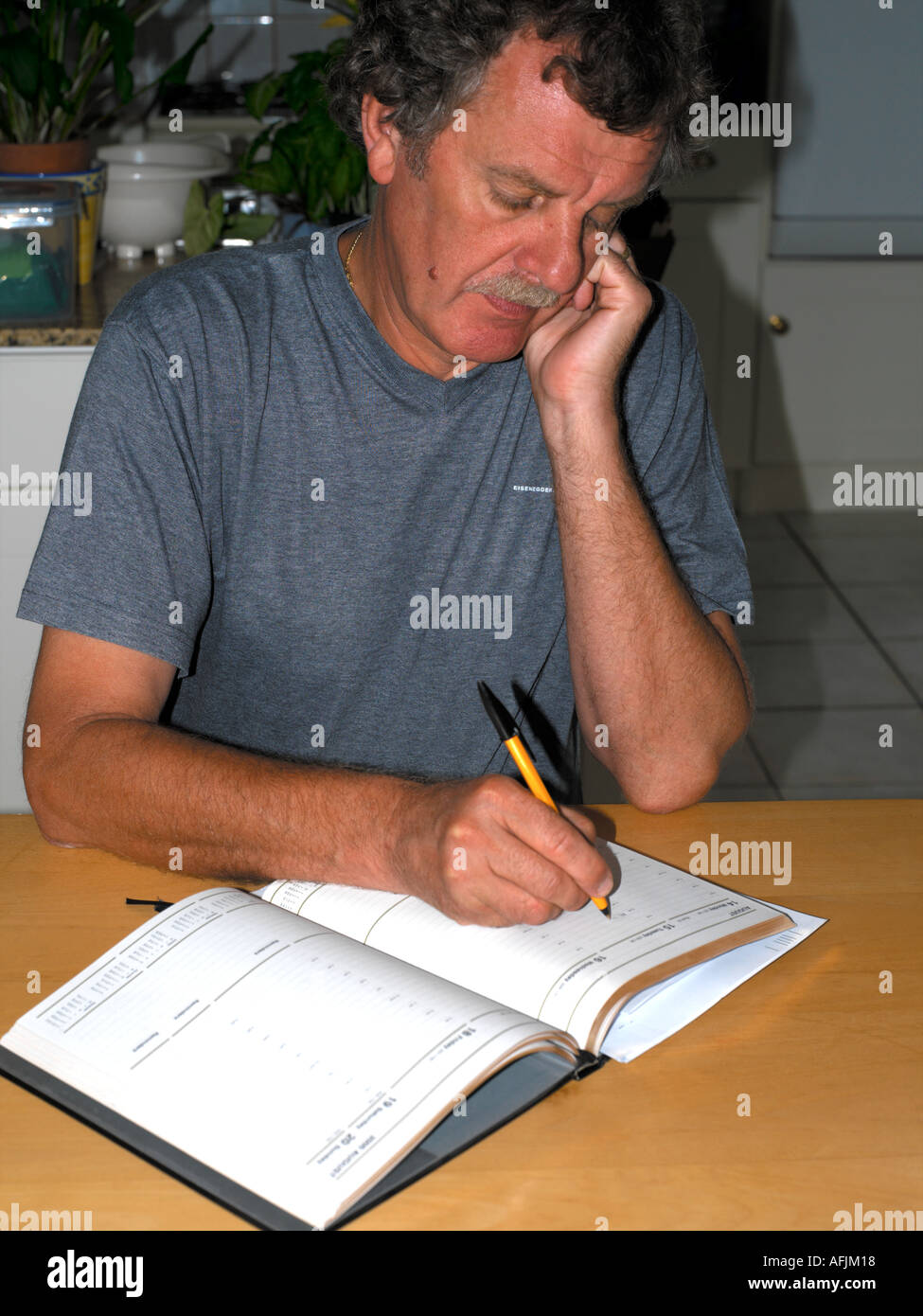 Writing in an Appointment Diary Stock Photo - Alamy