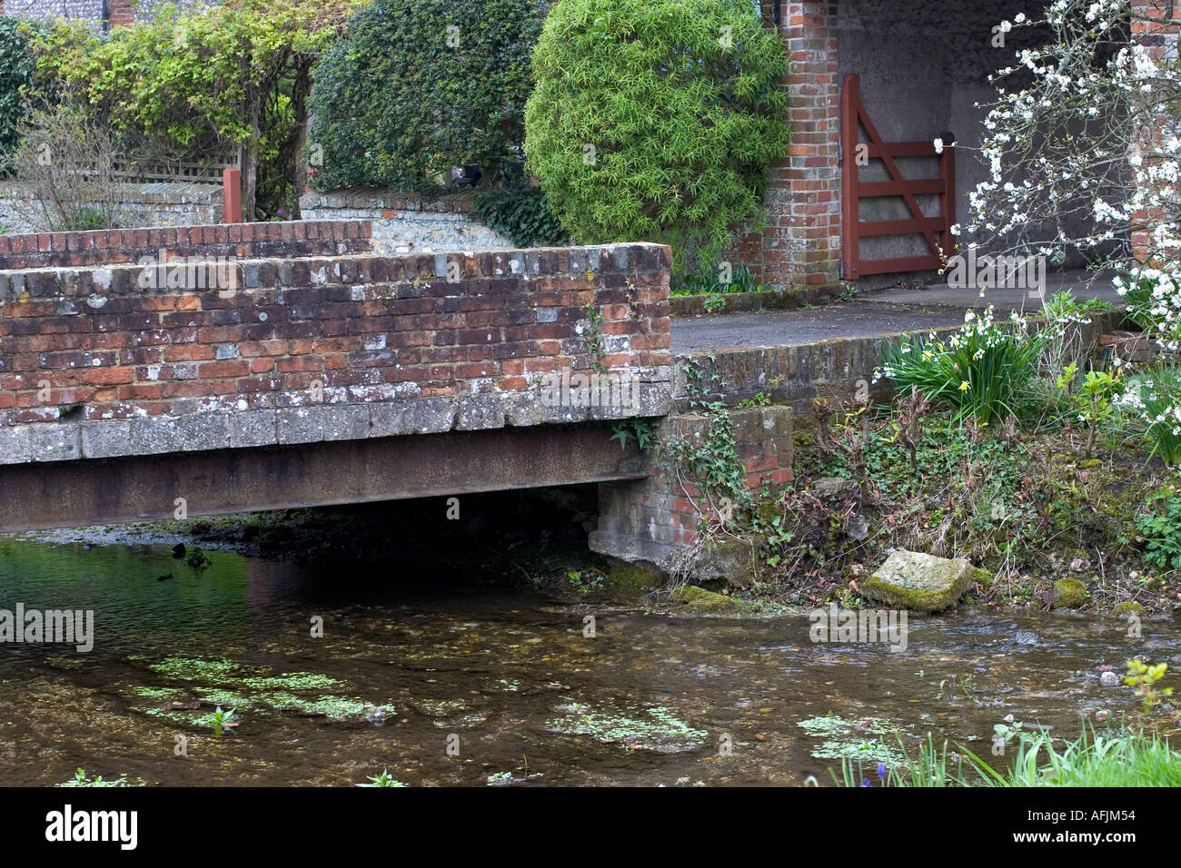 Bridge over stream in quaint village England Stock Photo - Alamy