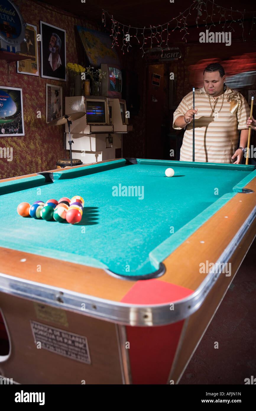 Young man playing pool Stock Photo - Alamy