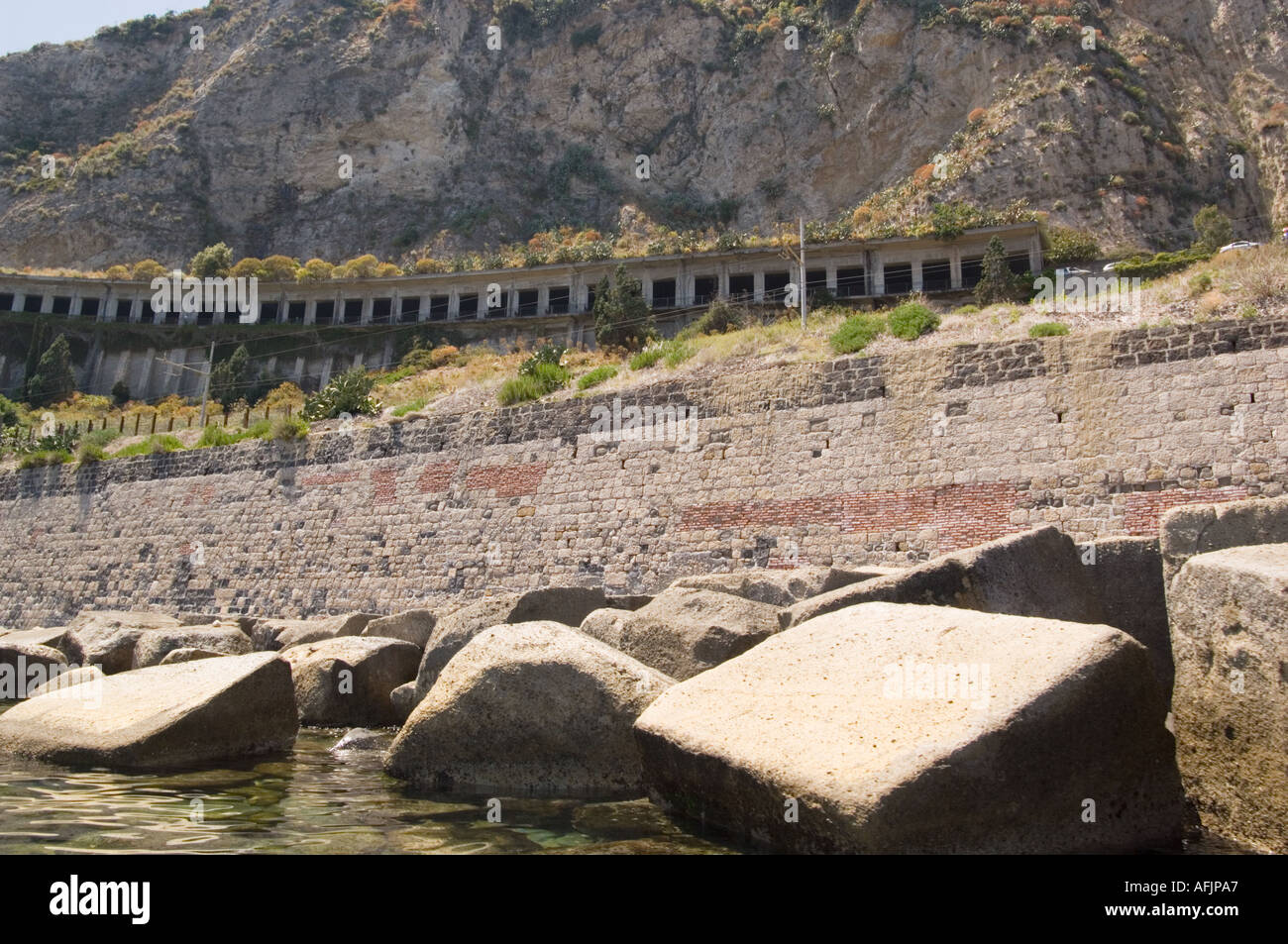 quarried stone blocks a brick retaining wall a train tunnel and a hill ...