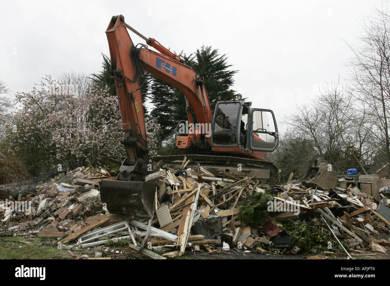 empty orange fiat hitachi JCB with cab door open on construction site ...