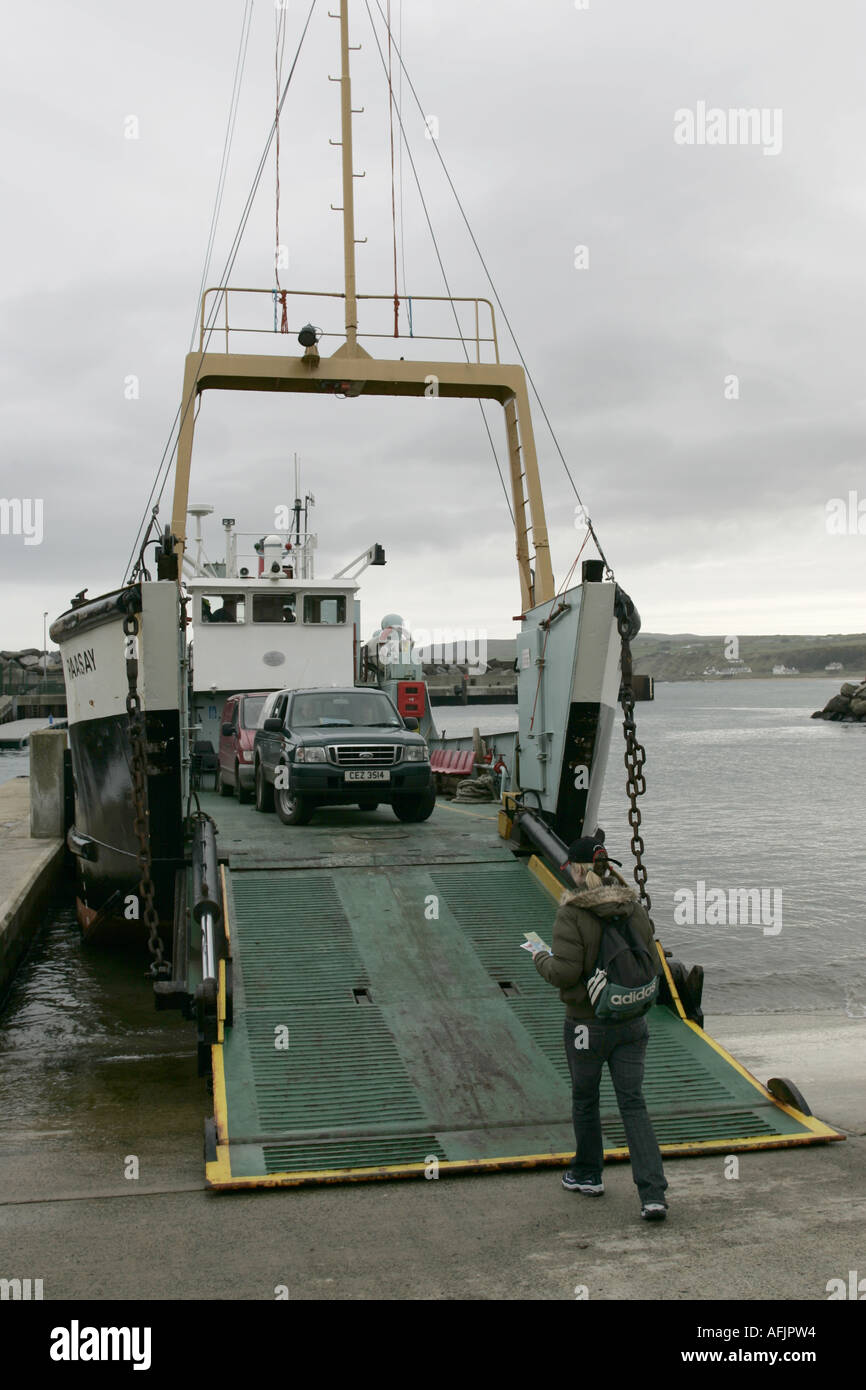 female tourist boarding the Caledonian MacBrayne MV Raasay ferry to ...