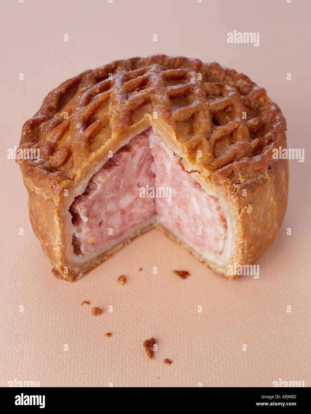 Whole pork pie with slice removed Stock Photo - Alamy