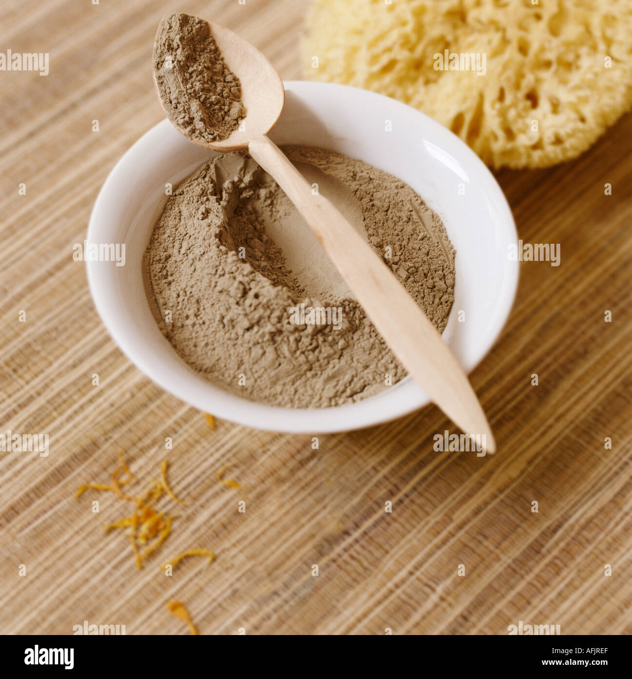 Bowl of clay with spoon and sponge Stock Photo - Alamy
