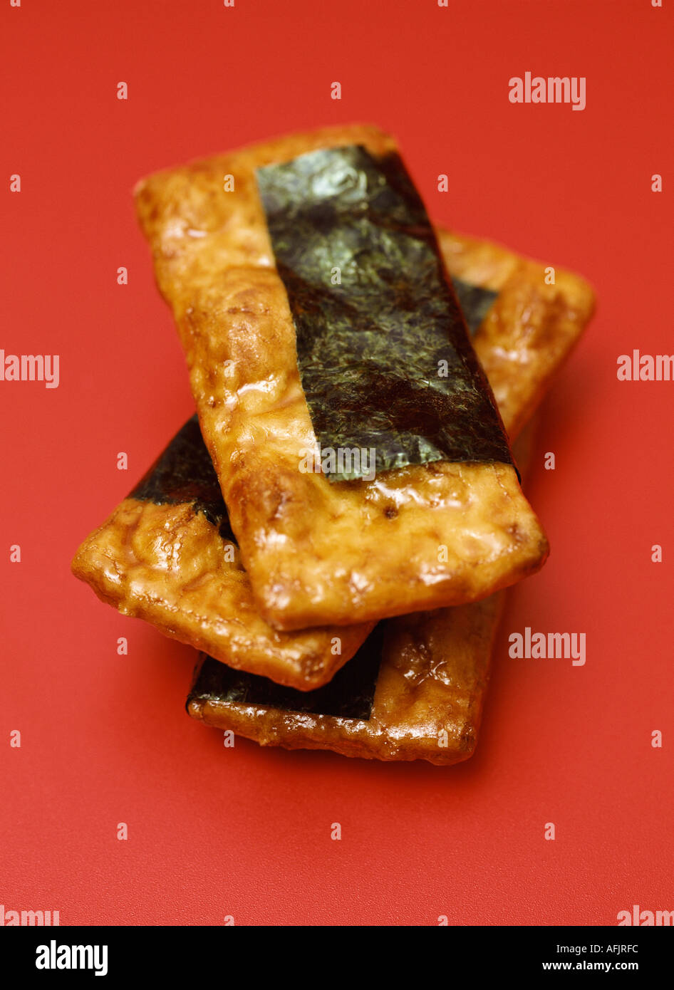 Stack of three japanese crackers on bright red plain background Stock ...