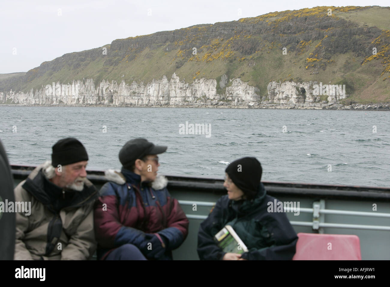 tourists on board the Caledonian MacBrayne MV Raasay ferry look at ...