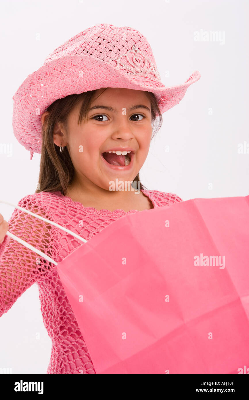 Young girl wearing pink cowgirl hat Stock Photo - Alamy