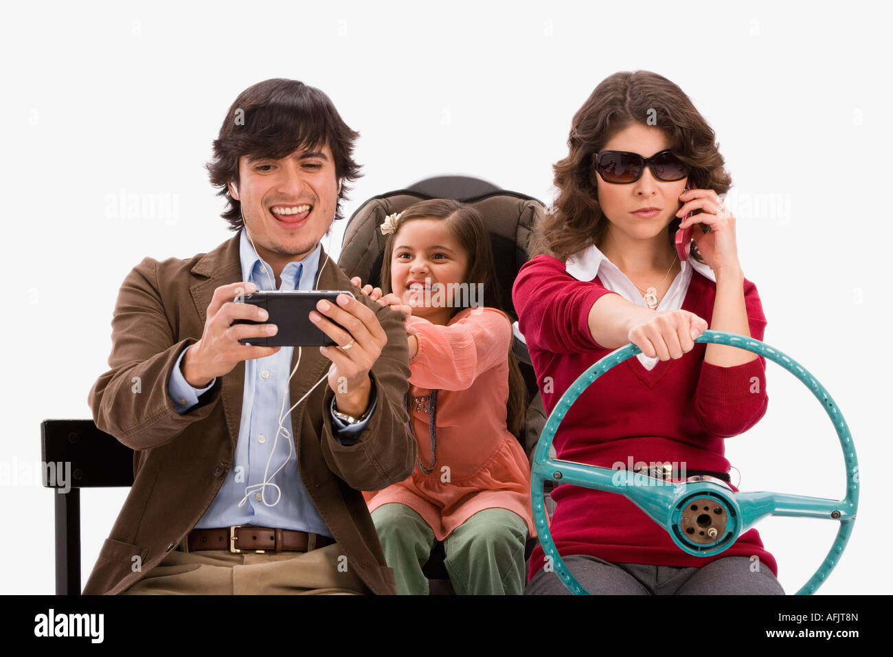 Distracted family in imaginary car Stock Photo - Alamy