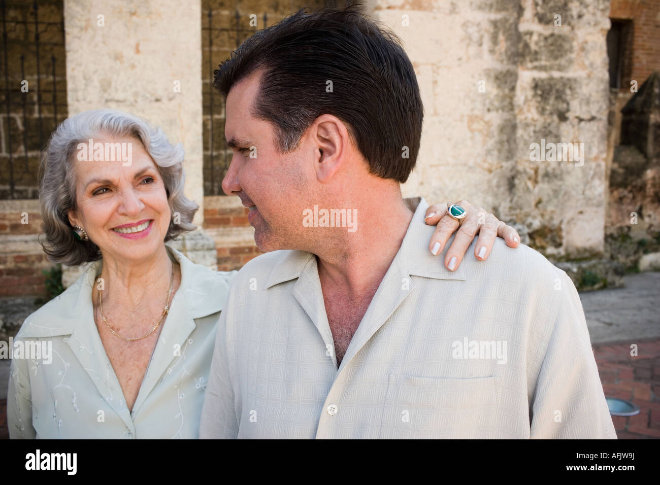 Man and his mother smiling at each other Stock Photo - Alamy