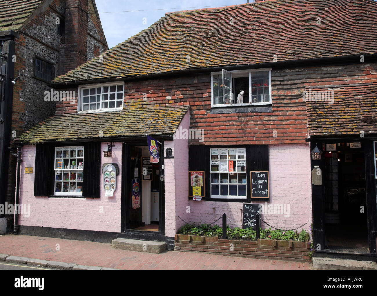 Old english village shop with amusing statue of a dog in the upstairs ...