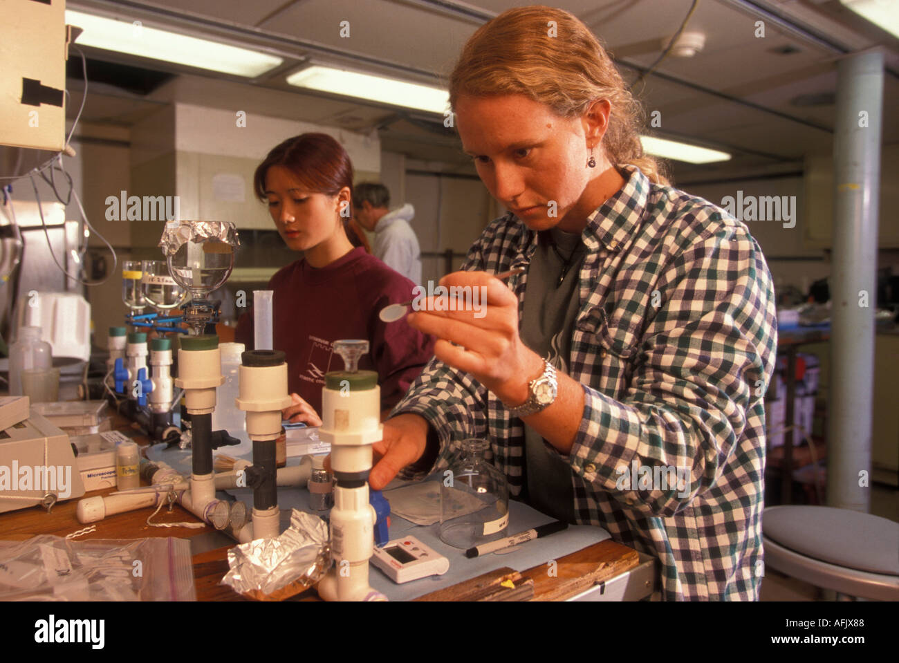 USA Oceanography grad student works in biological research lab aboard R ...