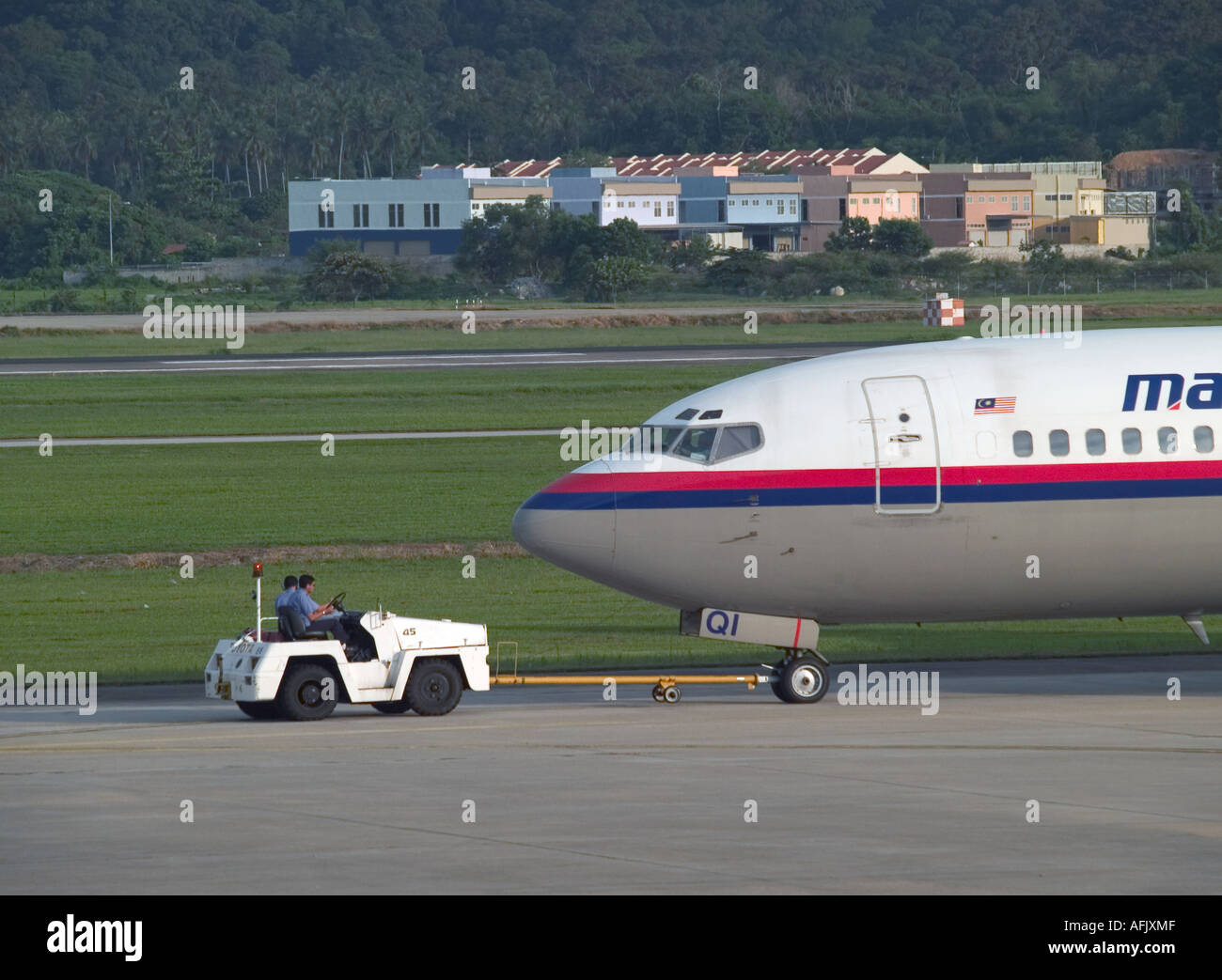 TRACTOR PUSH BACK FOR MALAYSIAN AIRLINES AIRCRAFT BEFORE TAXI TO RUNWAY ...