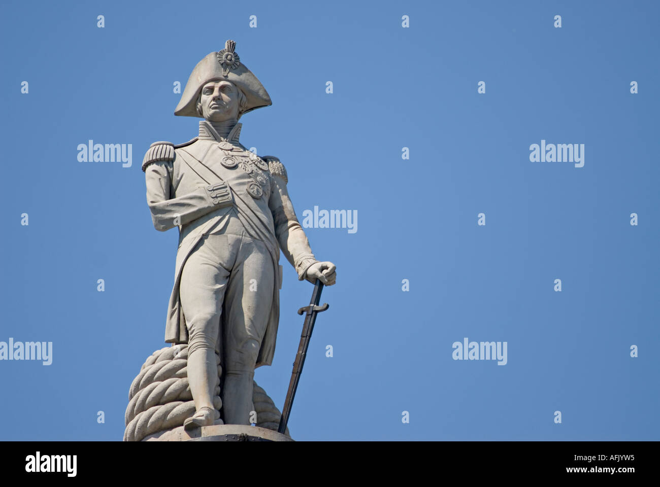 Statue of Admiral Nelson at the top of Nelsons Column Clear blue sky ...