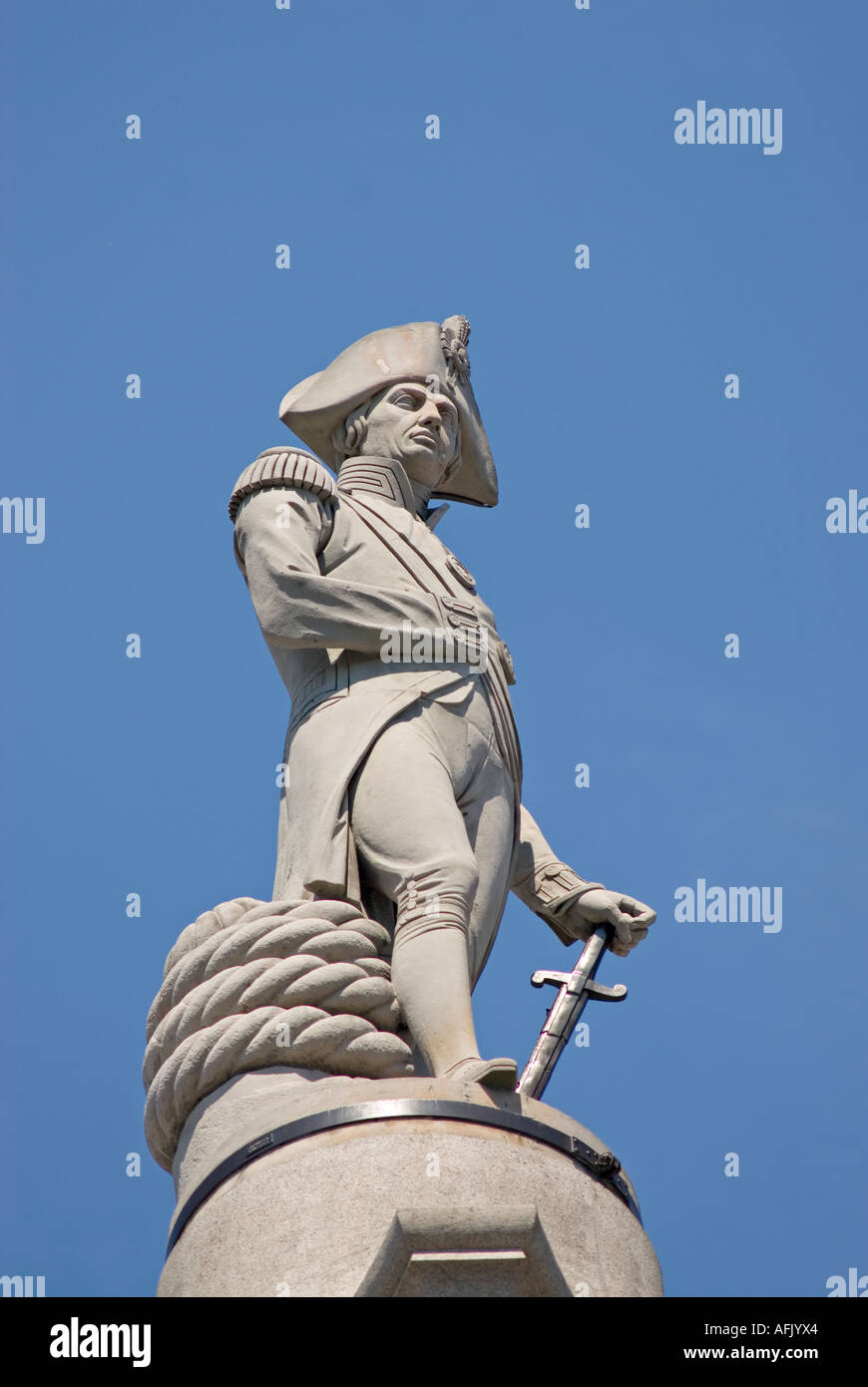 Statue of Admiral Nelson at the top of Nelsons Column Clear blue sky ...
