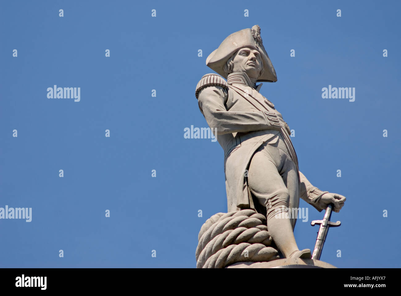 Statue of Admiral Nelson at the top of Nelsons Column Clear blue sky ...