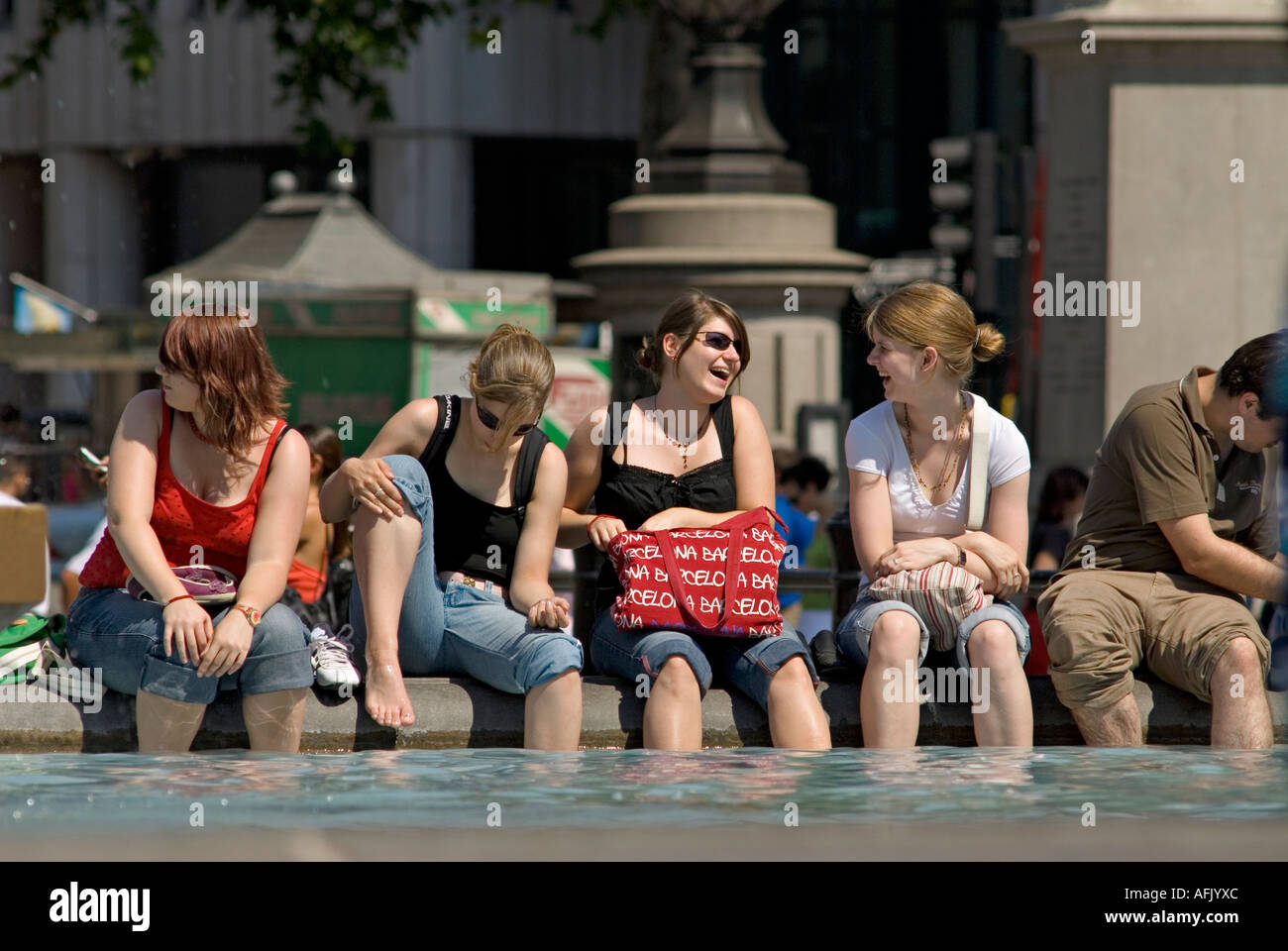 Tourists in London Group of friends enjoying a refreshing dip in the ...
