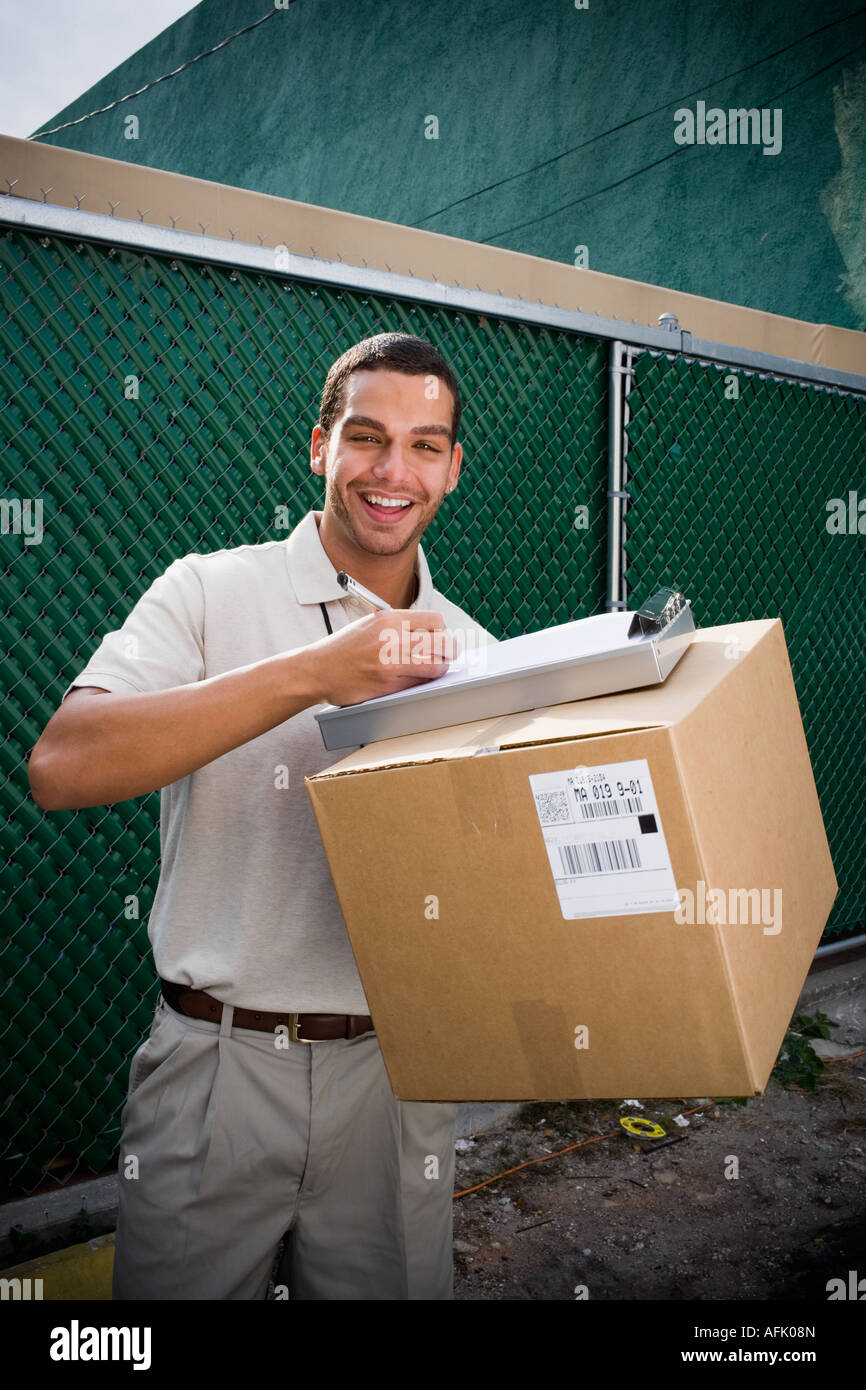 Delivery man making deliveries Stock Photo - Alamy