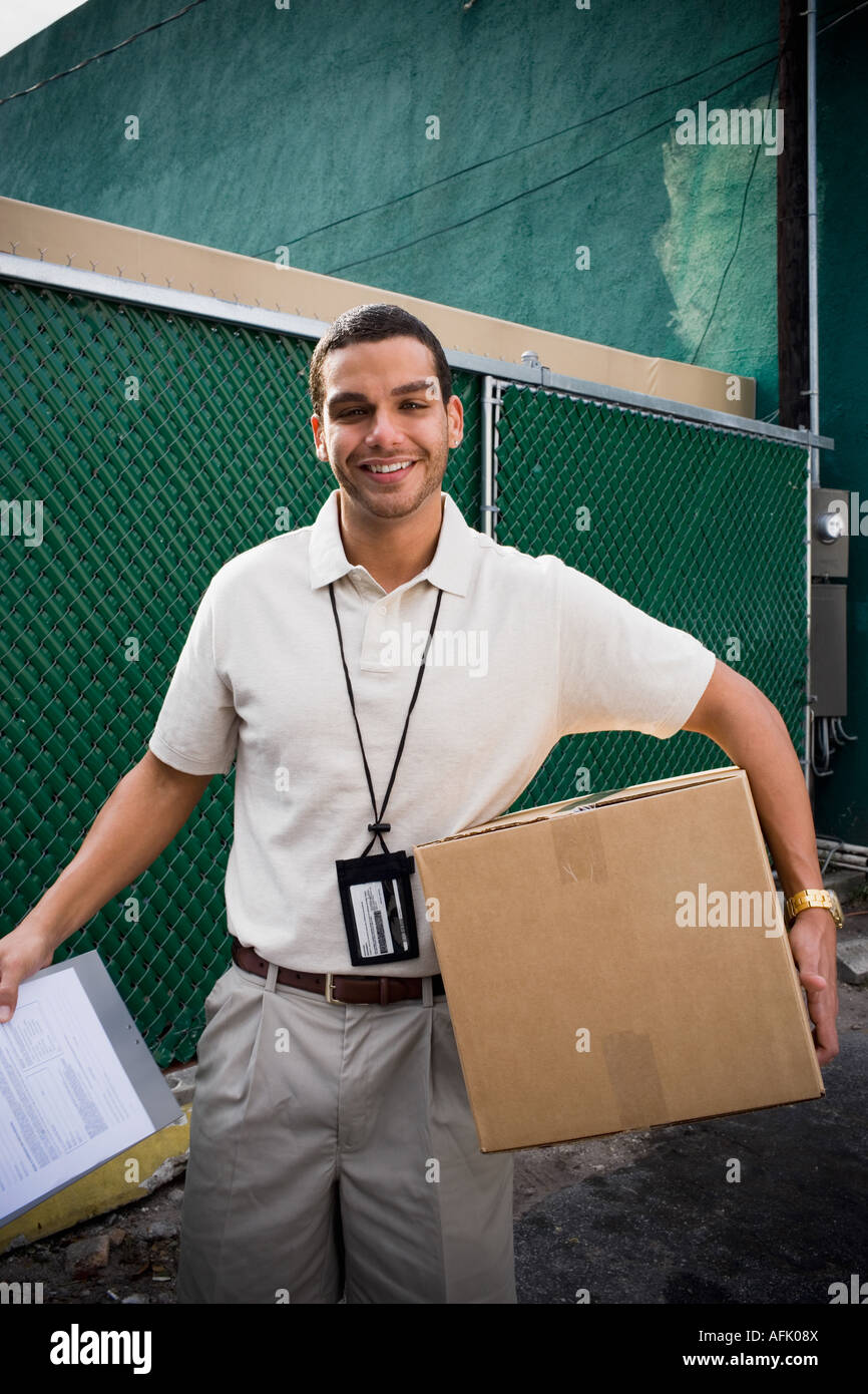 Delivery man making deliveries Stock Photo - Alamy