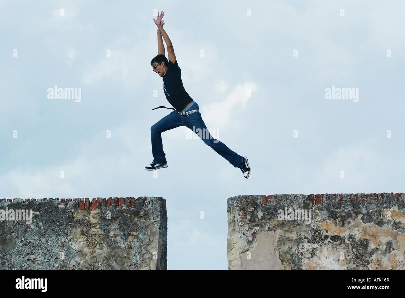 Young man jumping Stock Photo - Alamy
