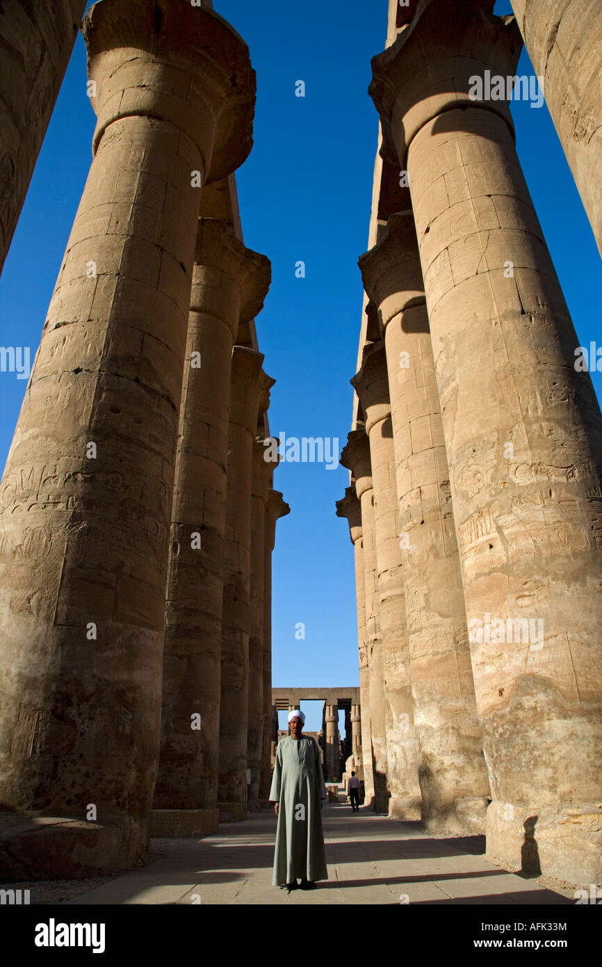 A guardian stands beneath the giant columns of the processional ...