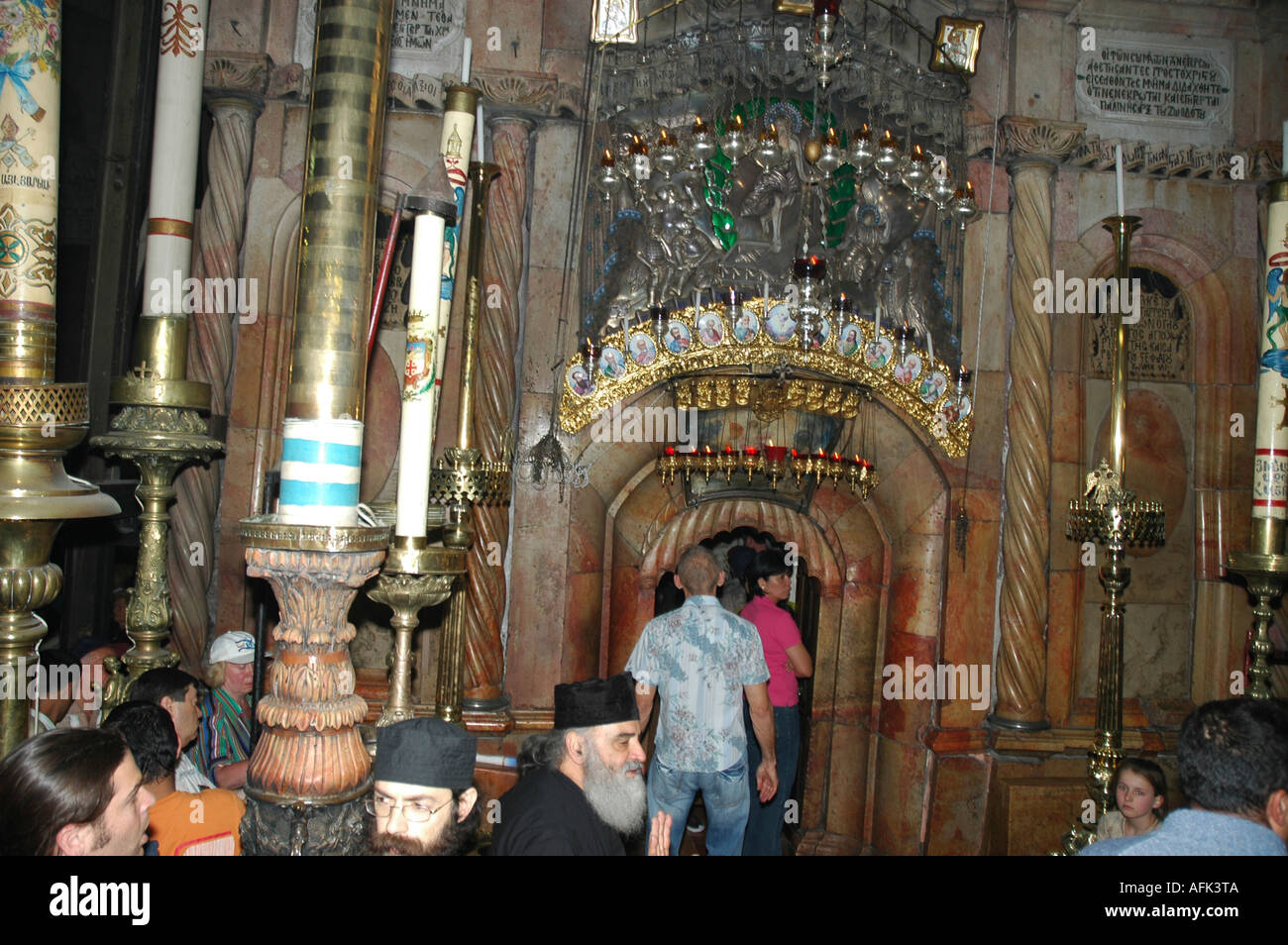Pilgrims at the Edicule at the center of the Rotunda in Church of the ...