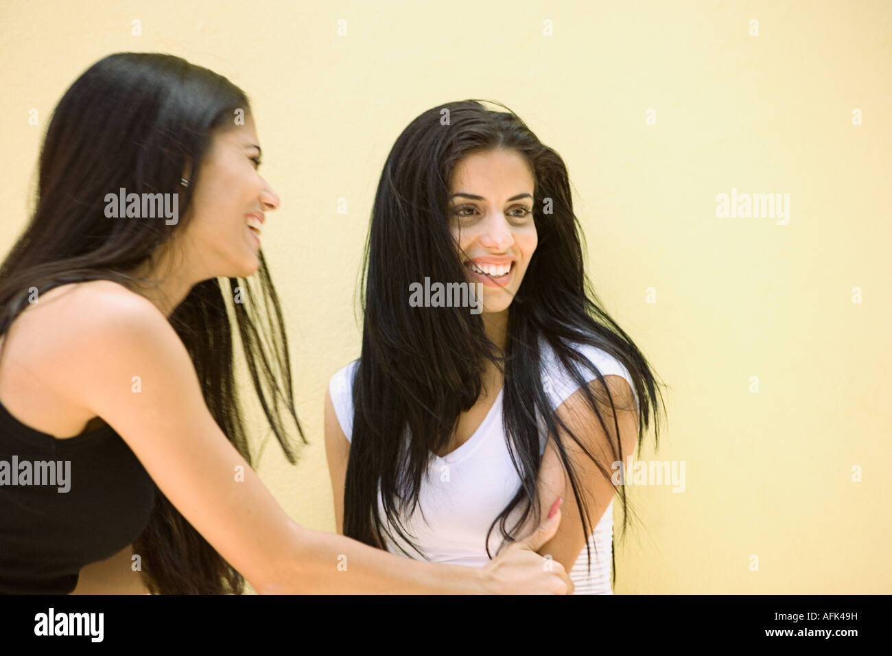 Two young women with long hair Stock Photo - Alamy