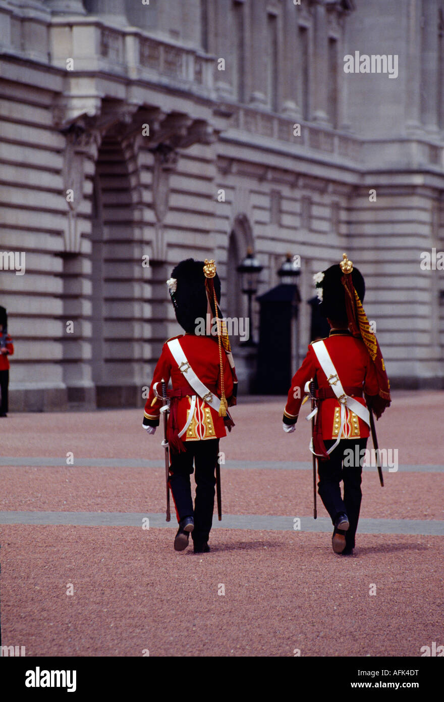 Guards patrol Buckingham Palace, London, England Stock Photo - Alamy