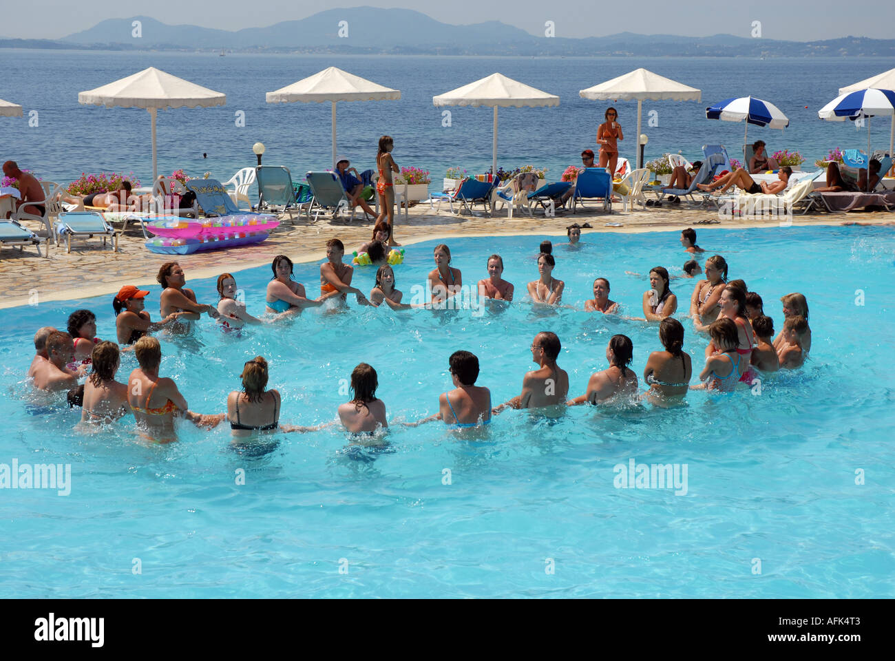 Group people in swimming pool hi-res stock photography and images - Alamy
