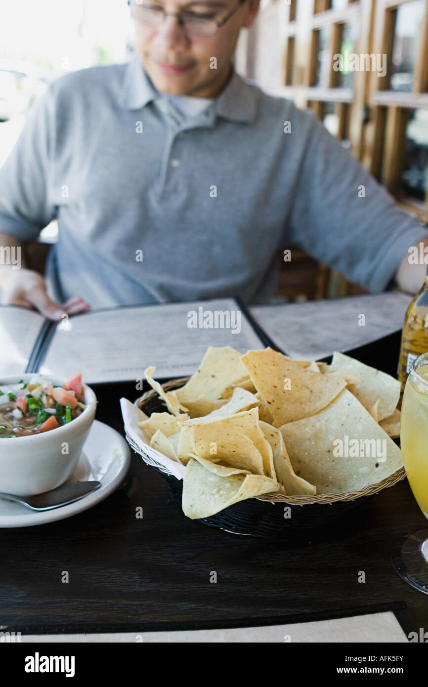 Man reading menu at outdoor restaurant Stock Photo - Alamy