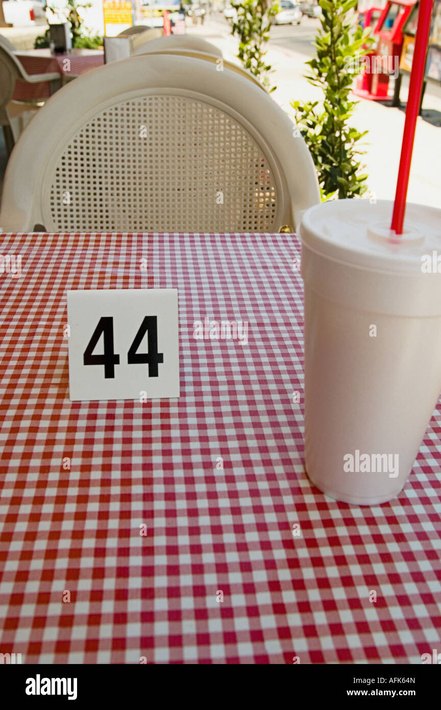 Front view of checkered outdoor restaurant table Stock Photo - Alamy
