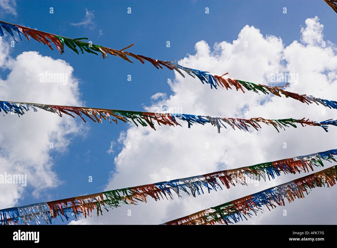 Car dealership streamers in sky with clouds Stock Photo - Alamy